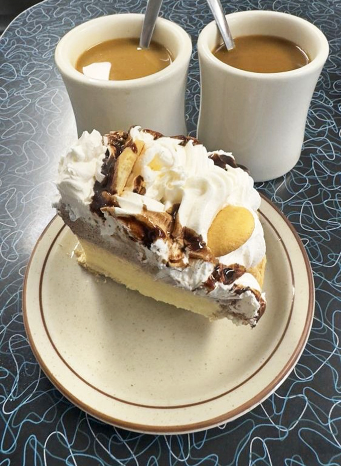 Two cups of coffee and banana cream pie prove that some conversations deserve proper dessert accompaniment.