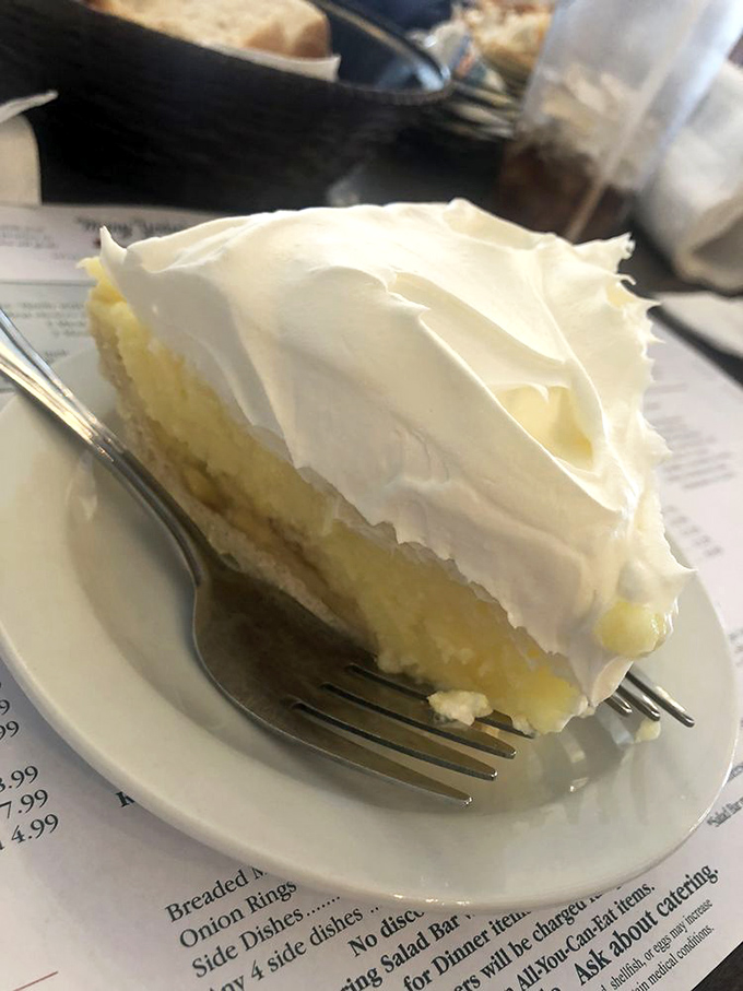 Cream pie so tall it needs its own zip code. That meringue defies both gravity and restraint&mdash;fork required, sharing optional.