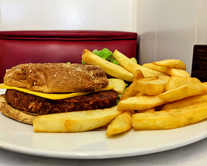 A burger that doesn't need Instagram filters or fancy toppings&mdash;just honest cooking on a well-seasoned griddle that's seen more history than most history books.