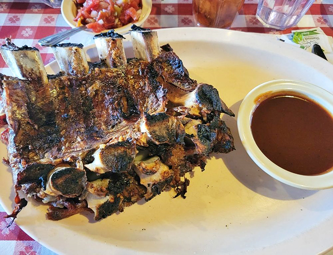 These beef ribs aren't just dinner; they're prehistoric monuments to carnivorous pleasure. Fred Flintstone would approve of their car-tipping heft and primal appeal.