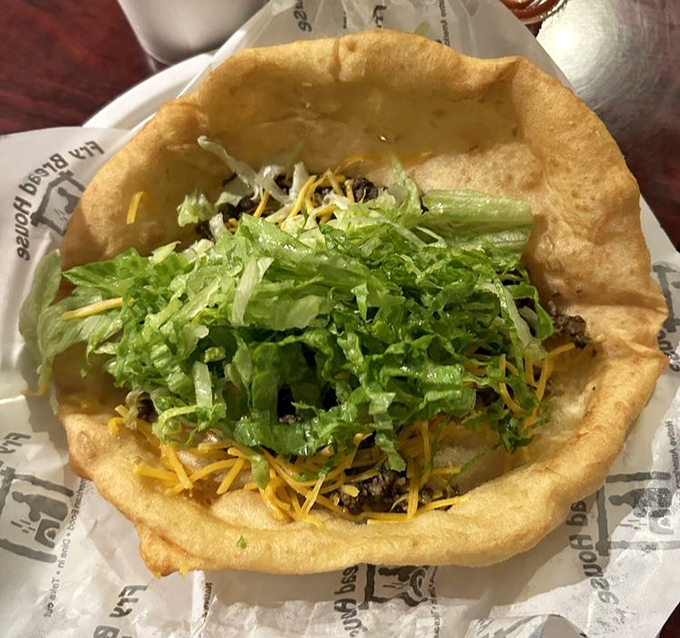 Behold the beef taco in its final form—a golden-fried canvas piled high with savory meat, cheese, and enough lettuce to make you feel virtuous.