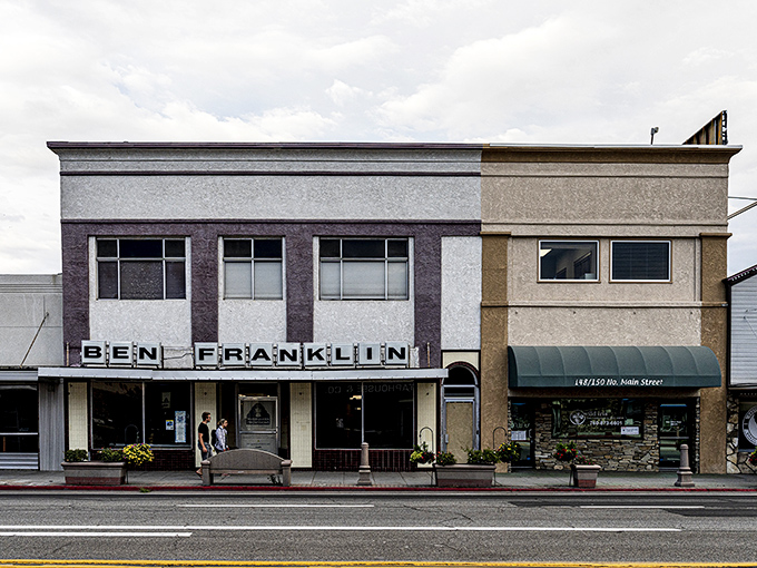 The Ben Franklin storefront stands as a charming reminder of Main Street Americana, where shopping was an experience, not just a transaction.