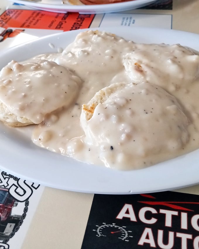 These biscuits aren't just smothered in gravy&mdash;they're embraced by it, a comforting hug on a plate that whispers, "Good morning, indeed."