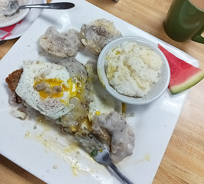 Biscuits and gravy that would make your Southern grandmother weep with joy, paired with eggs that know exactly when to stop cooking.