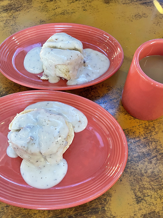 Biscuits and gravy that could settle territorial disputes—cloud-soft biscuits smothered in peppery country gravy that demands to be savored slowly.