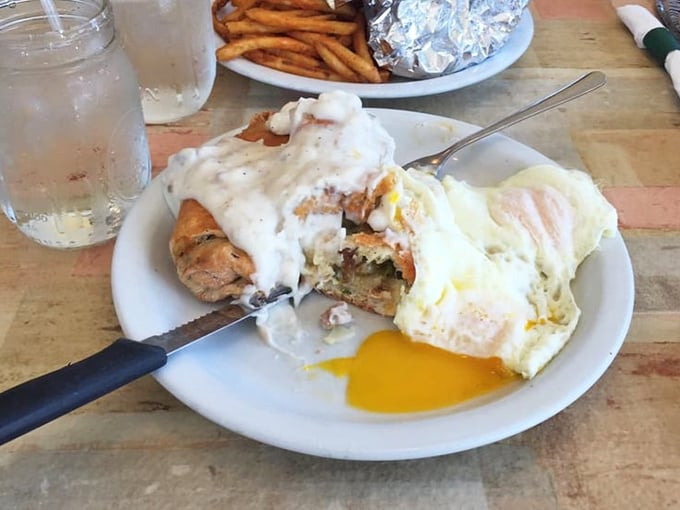 Biscuits and gravy with eggs sunny-side up&mdash;comfort food engineering at its finest. That golden yolk is about to create breakfast magic.