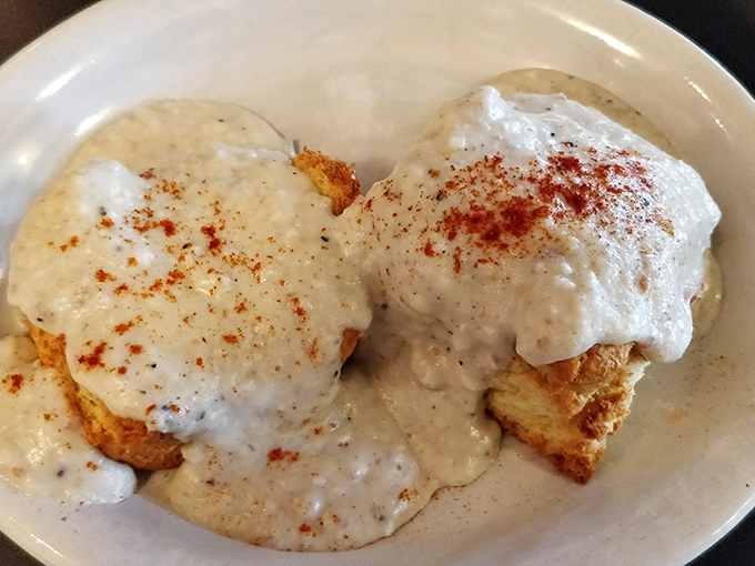 These biscuits and gravy look like they were sent from breakfast heaven&mdash;cloud-like biscuits swimming in creamy, peppery goodness that demands to be savored.