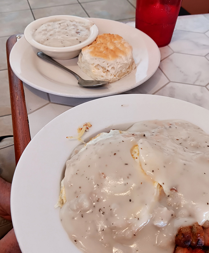 Biscuits and gravy: the Southern handshake that says "welcome to flavor country." That flaky biscuit practically begs to be dunked into that pepper-speckled gravy sea.