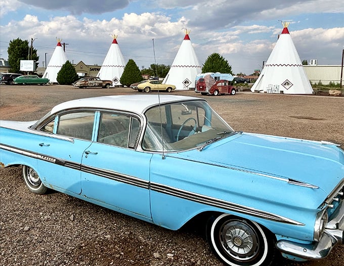 That baby blue Impala looks like it drove straight out of American Graffiti into this desert dreamscape.