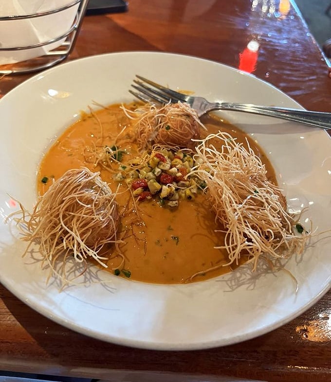 This soup isn't just wearing a fancy hat &ndash; those crispy wisps add texture to a creamy seafood bisque that's worth every delicious spoonful.