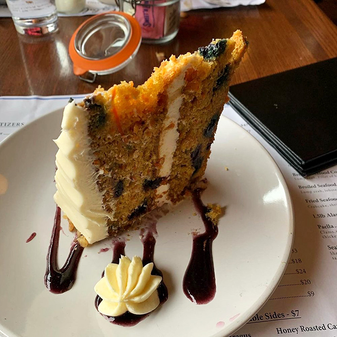 Whoever said you can't improve on carrot cake clearly never tried this blueberry-infused version, complete with artistic berry drizzle and perfect cream cheese frosting.