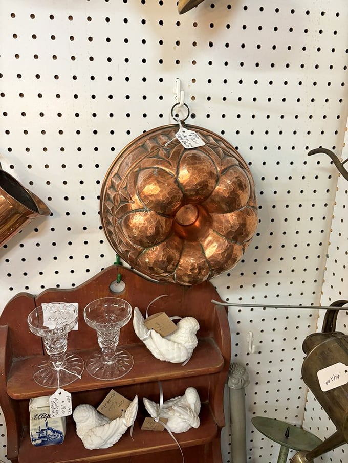 Copper and crystal dance together on this vintage display shelf. Those white porcelain birds are just waiting to migrate to someone's mantelpiece.