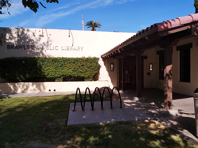 The Brawley Public Library stands as an oasis of knowledge and community connection, its vine-covered walls offering respite from the desert heat.