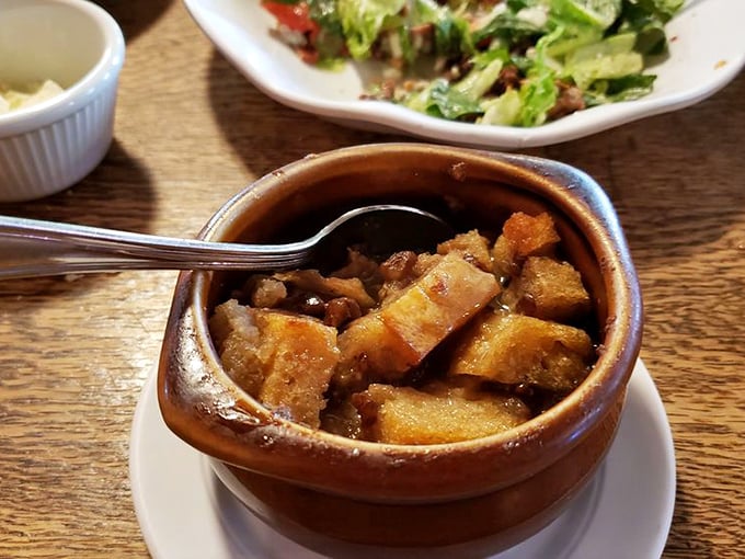 Not your cafeteria bread pudding&mdash;this warm, decadent creation swimming in what appears to be a bourbon-laced sauce is the dessert equivalent of a bear hug.