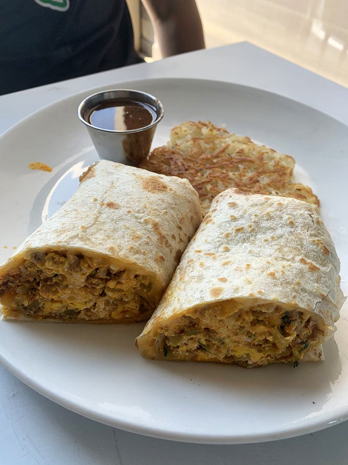 This breakfast burrito isn't messing around&mdash;it's the heavyweight champion of morning meals, with a side of crispy hash browns as its trusty sidekick.