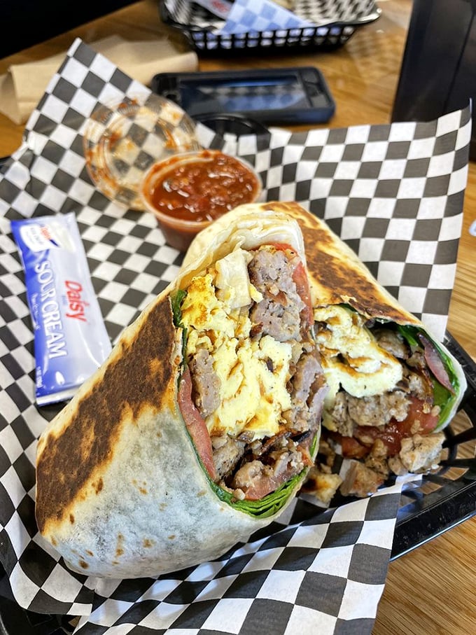 This breakfast burrito isn't just a meal, it's morning salvation wrapped in a tortilla &ndash; eggs, sausage, and cheese coming together like a sunrise symphony.