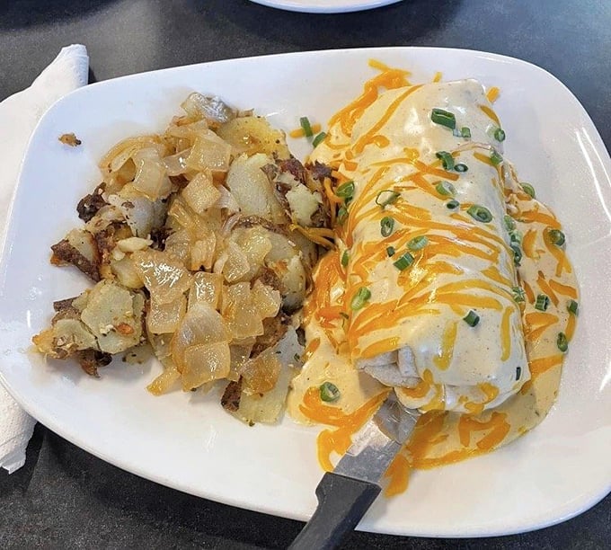 The Breakfast Enchilada proves that breakfast, like life, is better when wrapped in a tortilla and smothered with cheese.