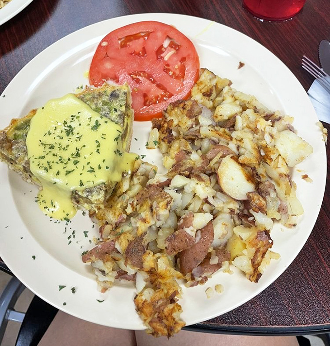 Breakfast geometry at its finest&mdash;golden triangles of egg perfection nestled beside home fries that could make a potato farmer weep with pride.