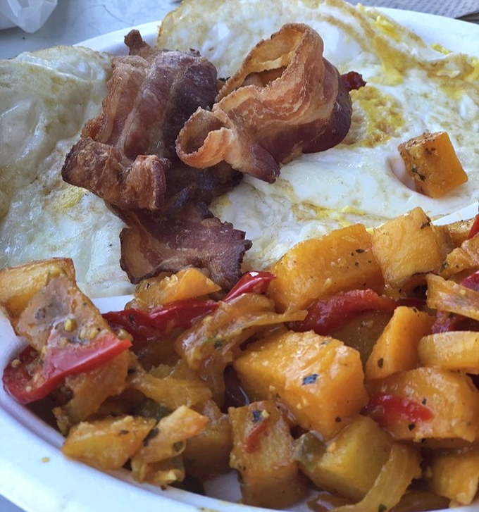 Breakfast of champions: crispy bacon, perfectly cooked eggs, and home fries that make you question every other potato you've ever eaten.