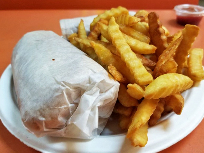 Wrapped in paper, not pretension, this breakfast bundle with golden fries is the morning equivalent of a warm hug.
