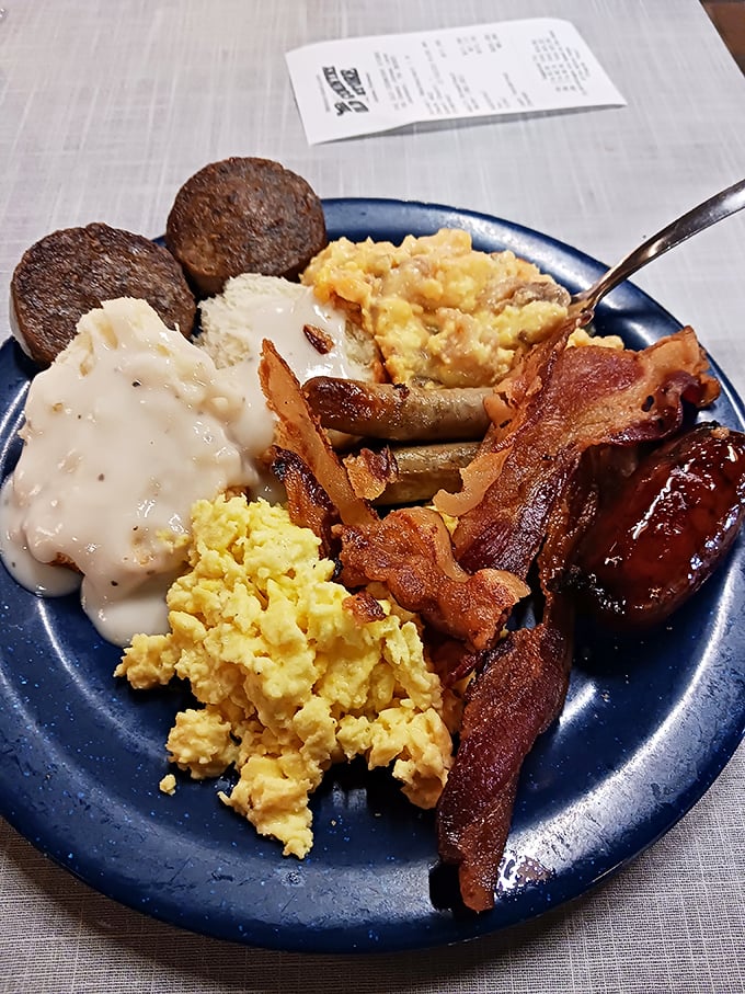 Breakfast of champions, Tennessee-style: scrambled eggs, biscuits with gravy, bacon, sausage, and hash browns that would make any grandma proud.