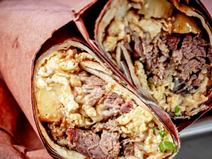 Breakfast meets barbecue in these hefty burritos. Like a sleeping bag for your favorite smoked meats, with eggs as the pillows.