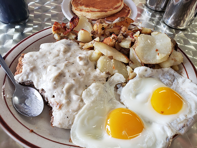 Eggs, potatoes, and gravy sharing a plate isn't just breakfast&mdash;it's a morning summit meeting of comfort food diplomacy.