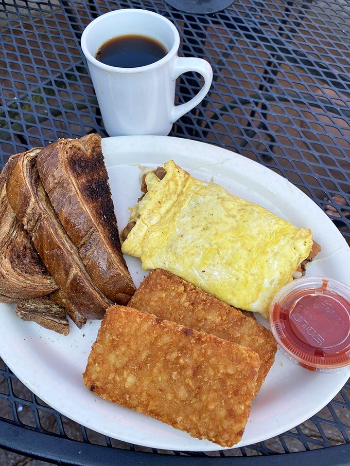 Breakfast nirvana: golden omelet, perfectly crisped hash browns, and toast the color of a summer tan. Coffee mandatory, diet optional.