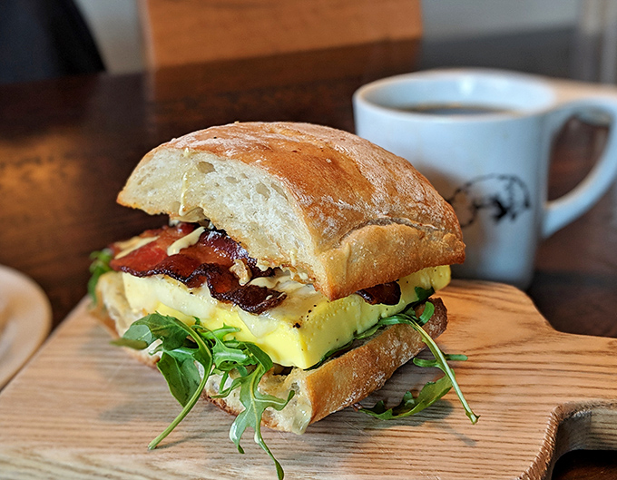 This isn't just a breakfast sandwich&mdash;it's architectural genius. Souffl&eacute;d eggs, crisp bacon, and fresh greens create the Taj Mahal of morning meals.