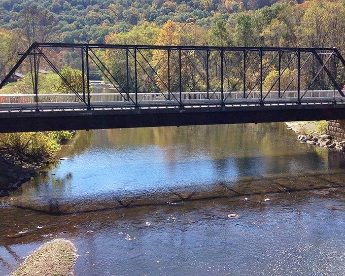 This isn't just any bridge&mdash;it's a portal connecting today's peaceful countryside with yesterday's industrial revolution, spanning more than just water.