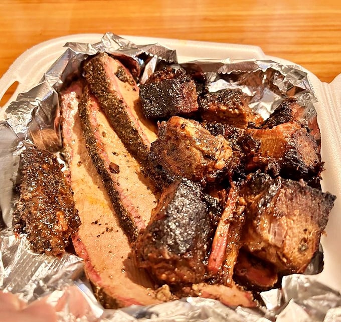 Brisket with a bark so perfect it deserves its own standing ovation. That smoke ring isn't just color&mdash;it's a flavor timeline.