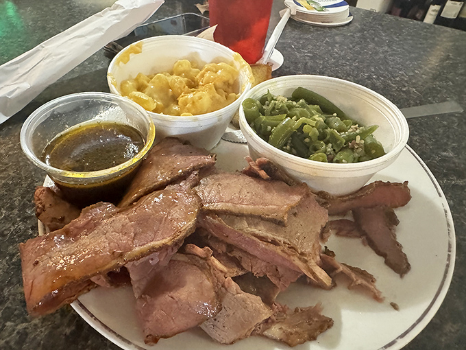 Brisket sliced so perfectly it could make a geometry teacher weep with joy. The smoke ring is the BBQ equivalent of a designer label.