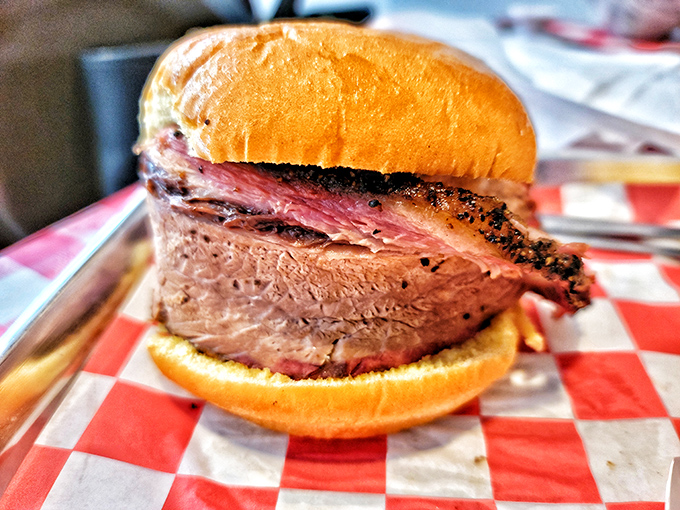 This brisket sandwich is so thick and juicy, you'll need both hands and possibly a construction permit. 