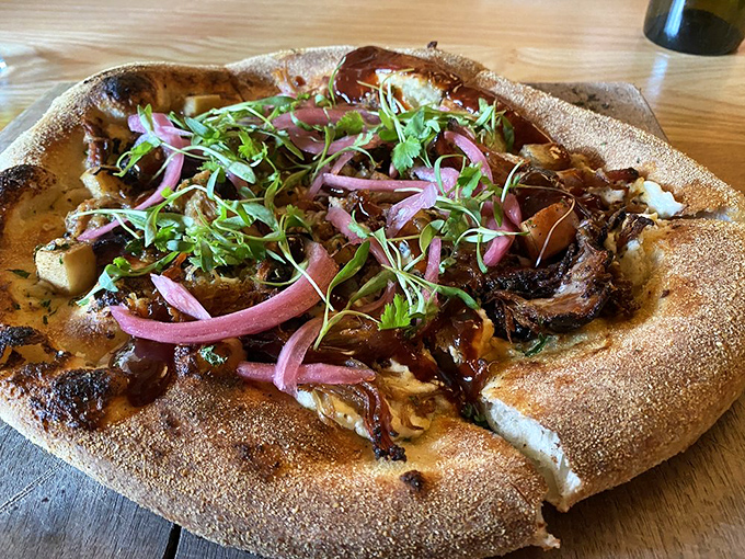 Pizza transcends to art form when wood-fired with toppings that tell a story&mdash;this brisket creation with red onions and microgreens would make any Italian grandmother nod approvingly.
