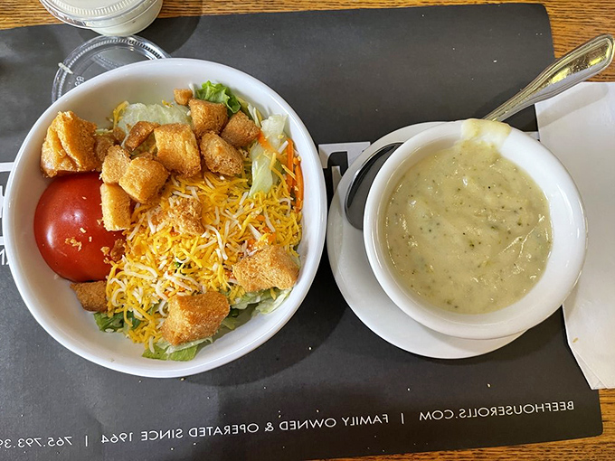The salad might be a formality before the meat arrives, but that creamy broccoli cheese soup? That's no mere opening act.