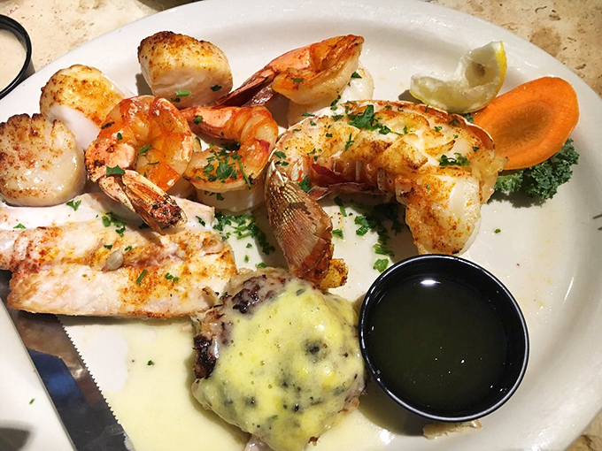 The seafood sampler that answers the eternal question: "Why choose one when you can have it all?" Scallops, shrimp, and fish sharing a plate in perfect harmony.