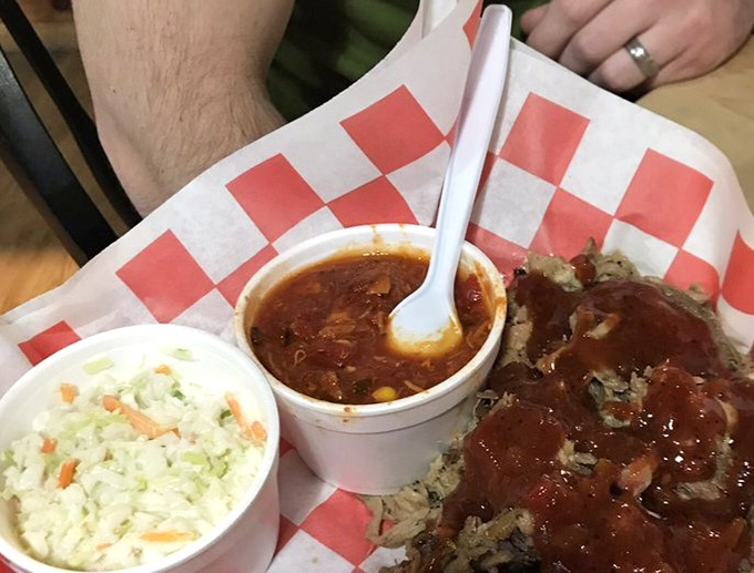 Brunswick stew that would make grandma jealous, coleslaw for cooling the palate, and pulled pork wearing sauce like a well-tailored suit.