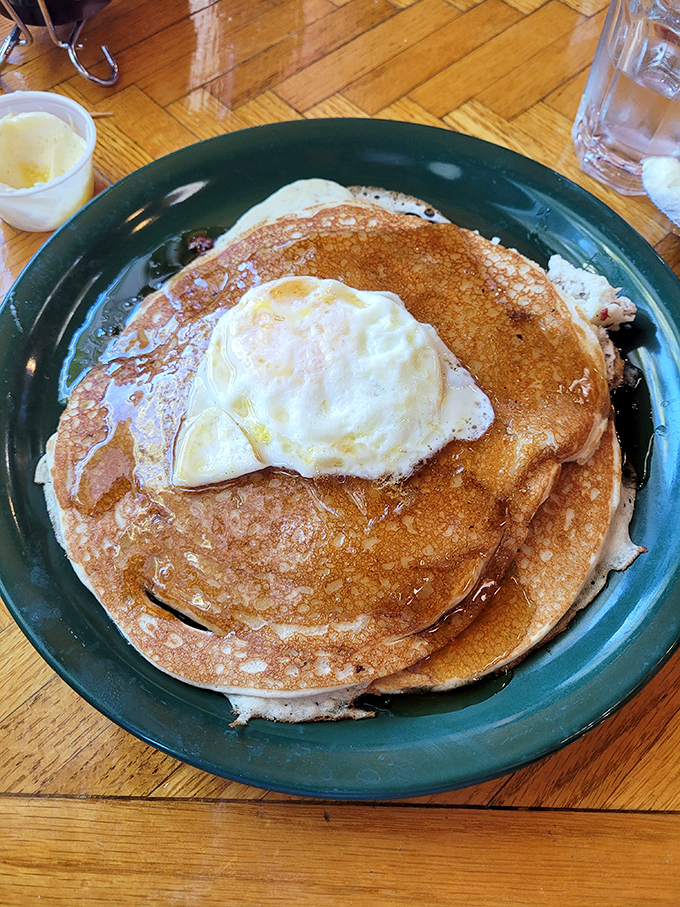 Pancakes topped with a perfect sunny-side-up egg&mdash;because sometimes breakfast needs to wear a hat to formal occasions.