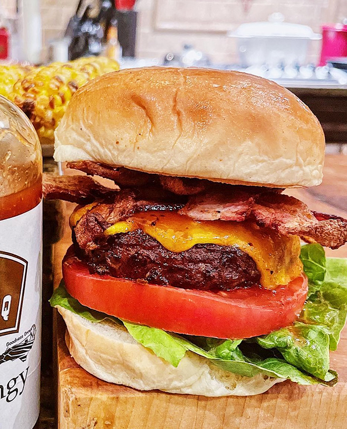 This isn't just a burger; it's architecture. Note how the bacon and cheese create a perfect structural support system for maximum flavor delivery.