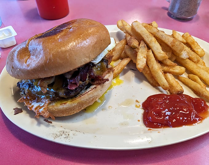 A burger that requires a strategy to eat and fries that achieve that perfect crisp-outside-fluffy-inside ratio. Ketchup optional, napkins mandatory.