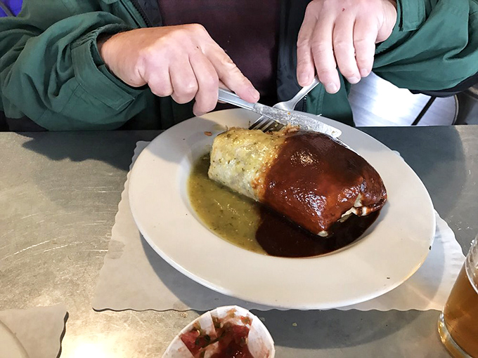 This isn't just a burrito&mdash;it's architecture. A masterpiece of culinary engineering draped in two contrasting sauces like a delicious yin-yang.