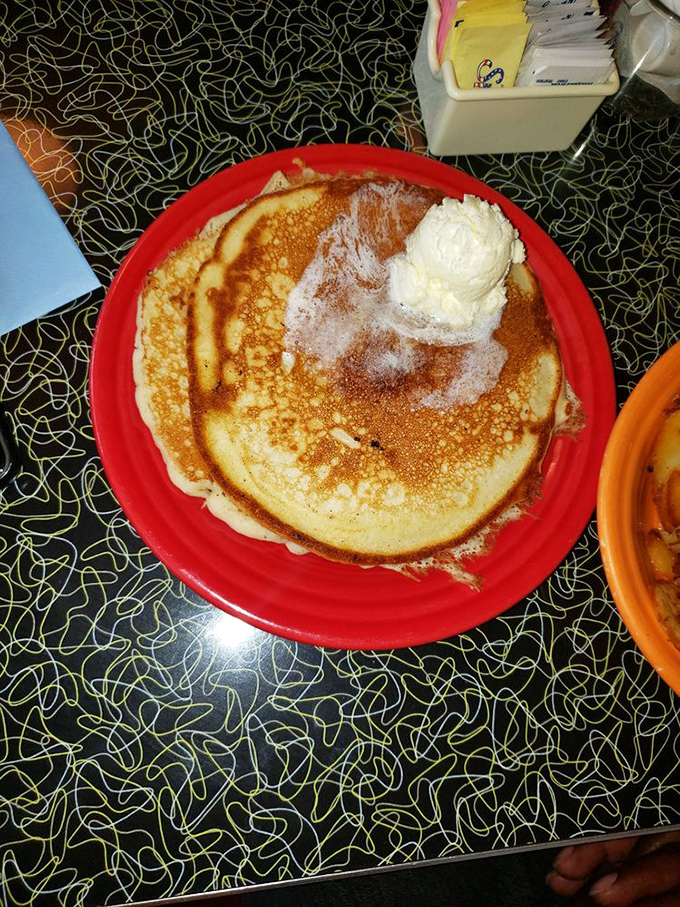 This pancake doesn't just sit on the plate&mdash;it commands it, with a dollop of butter melting like a morning sun.