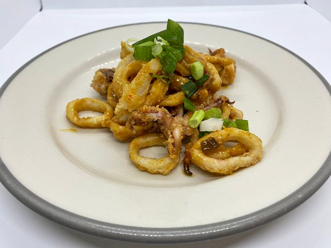 These calamari rings aren't just fried &ndash; they're given the royal treatment with a sprinkle of scallions that brightens every crispy bite.