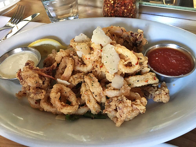 Crispy calamari that shatters with each bite, paired with two dipping sauces. This isn't rubbery seafood purgatory&mdash;this is squid elevated to art form.