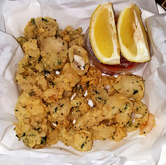 Crispy calamari that shatters with each bite, served with lemon wedges that add just the right amount of brightness to cut through the richness.