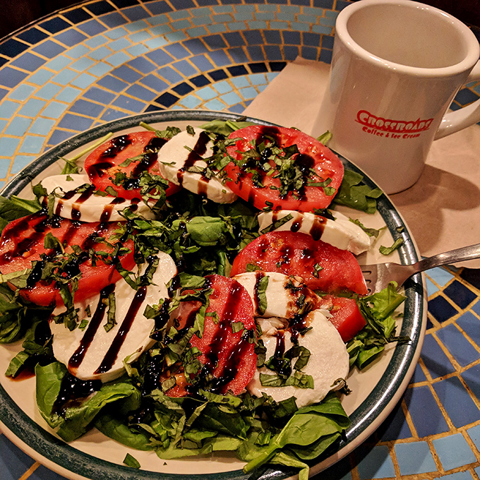 A caprese salad that respects the tomato enough to let it be the star. Summer on a plate with a coffee chaser.