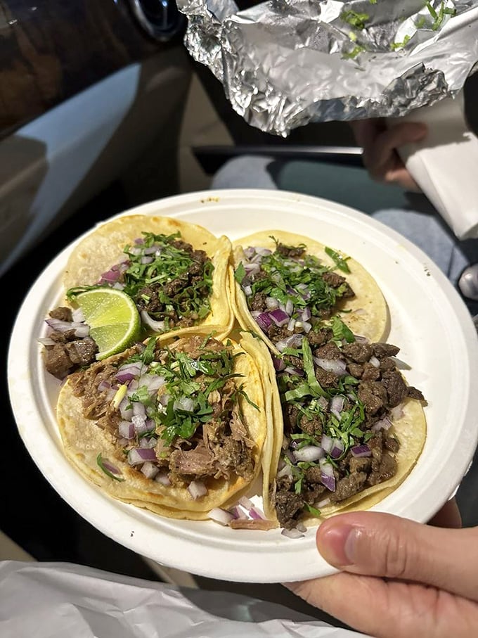 Carne asada and carnitas street tacos in their purest form &mdash; simple corn tortillas cradling perfectly seasoned meat, topped with cilantro, onion, and a squeeze of lime. No frills. Just perfection.
