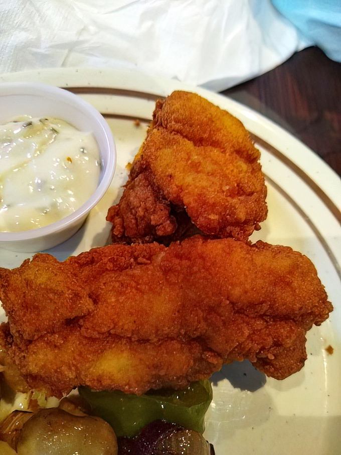 Golden-fried catfish that would make any Southern grandmother nod in approval. The crispy exterior hides perfectly flaky treasure within.
