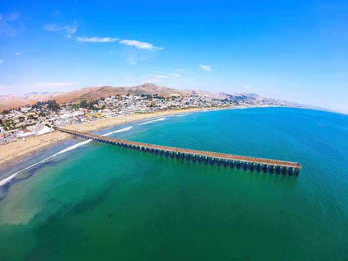 From this angle, Cayucos reveals its true colors&mdash;turquoise waters meeting golden shores, with that magnificent pier stealing the show.
