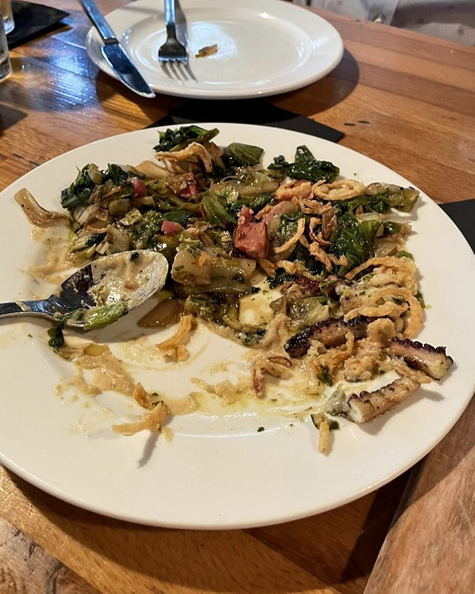 The charred octopus doesn't just arrive&mdash;it makes an entrance. Those crispy edges and vibrant vegetables are having their own little garden party.